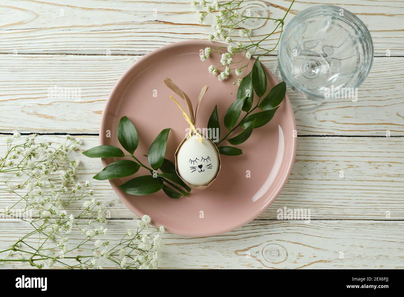 Happy Easter table setting with Easter bunny made of egg on wooden ...