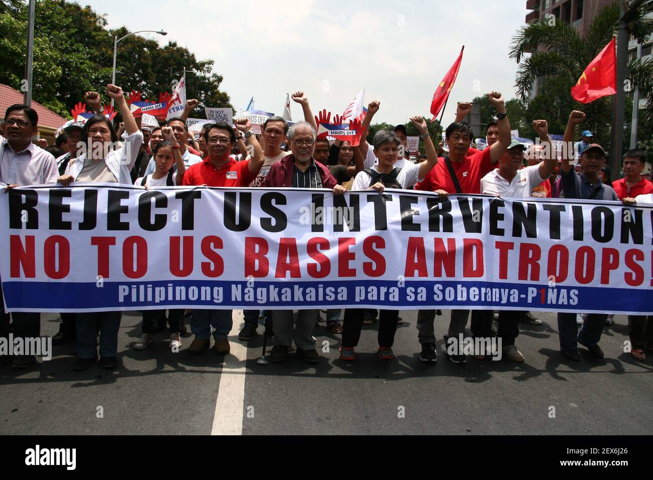 Former senator Rene Saguisag (center maroon jacket) lead the march to ...