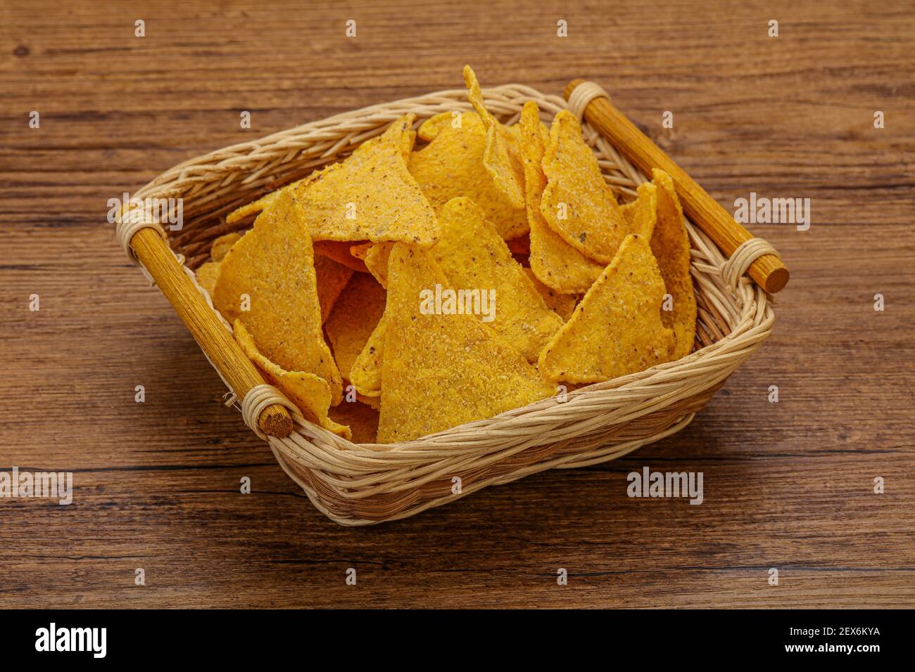 Mexican crunchy corn nachos triangle heap Stock Photo - Alamy