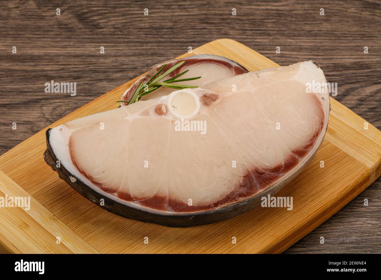 Raw shark steak served rosemary for cooking Stock Photo - Alamy