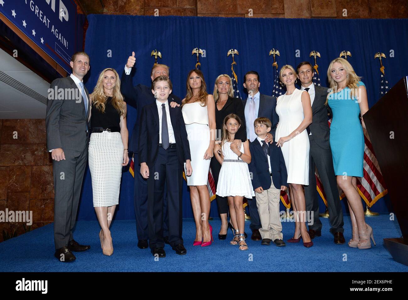 Real estate mogul and TV personality Donald Trump stands with his ...