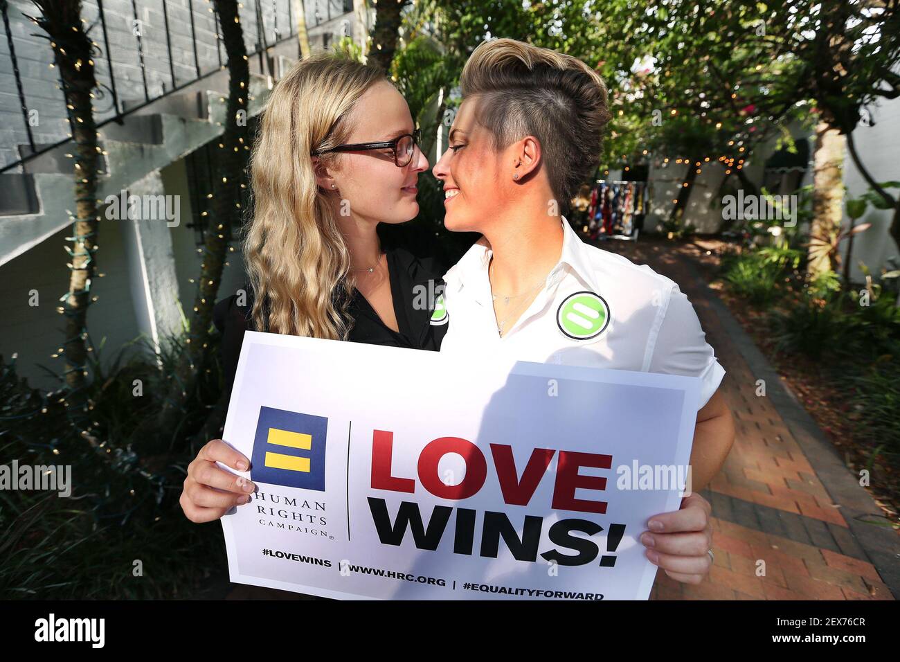 Malene Shak, left, and her wife Carrie Shak embrace in Orlando, Fla ...