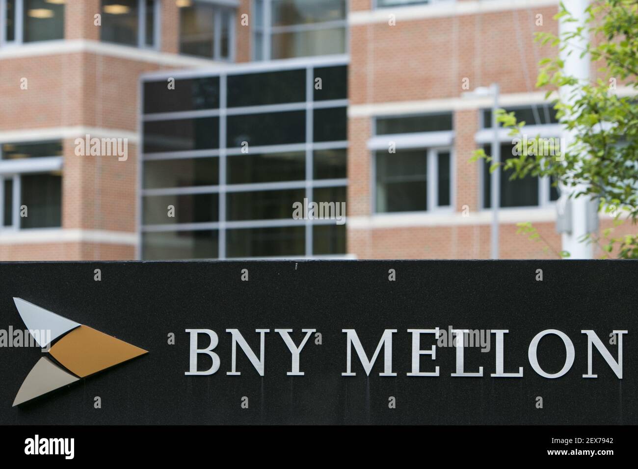 A logo sign outside of a facility occupied by The Bank of New York ...