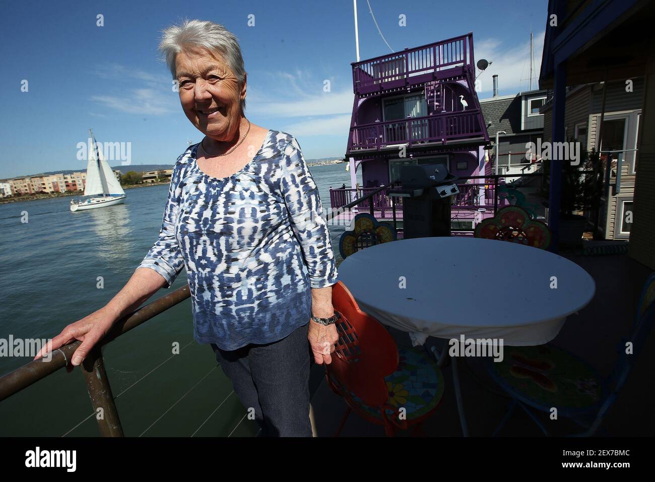 Angela McIntyre looks out from the deck of her floating home at the ...