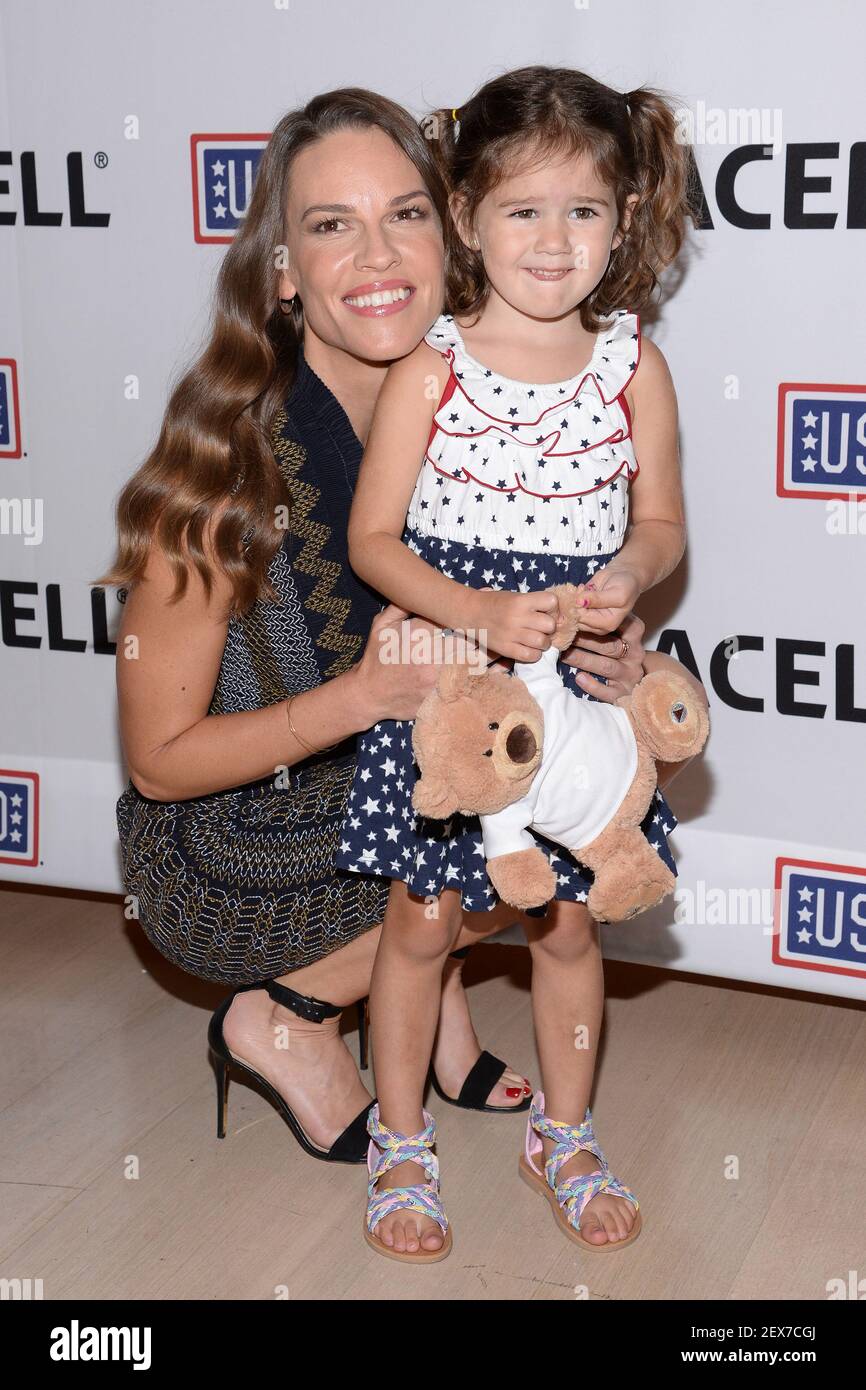 (L-R) Hilary Swank and Mackenzie Nilson, daughter of a military family ...