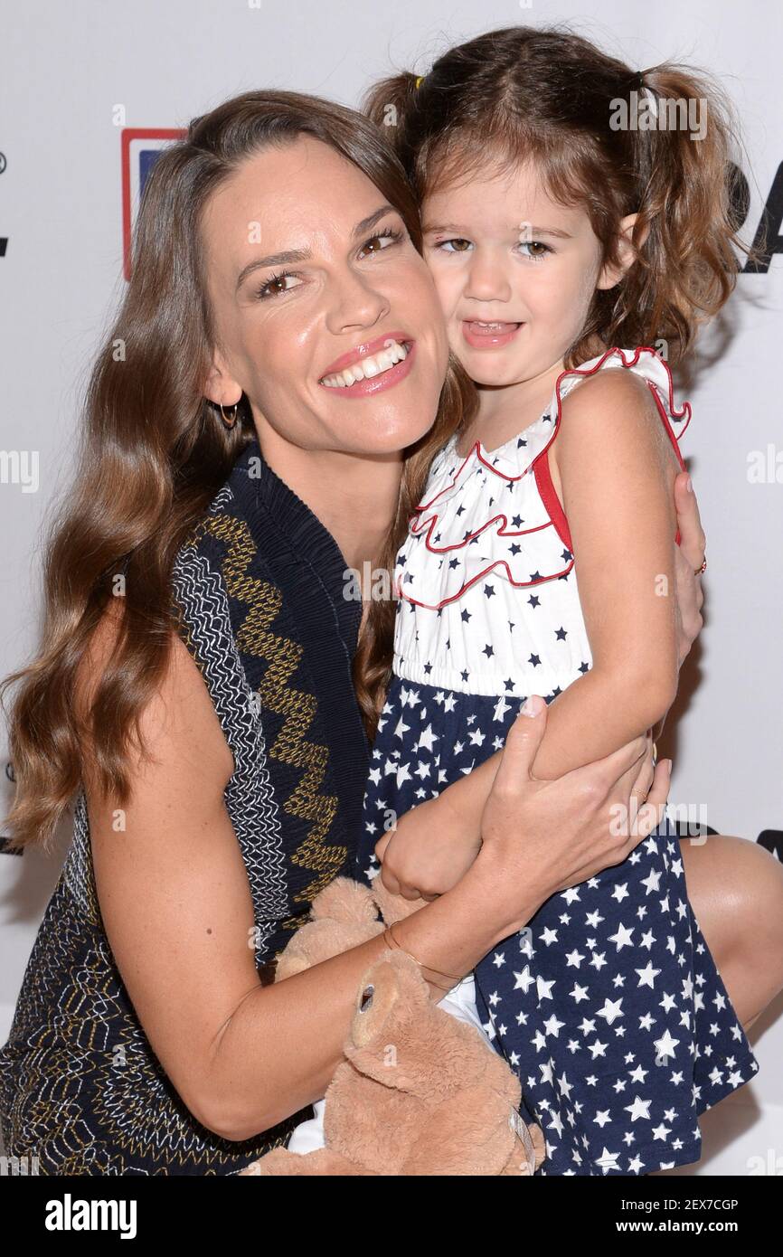 (L-R) Hilary Swank and Mackenzie Nilson, daughter of a military family ...