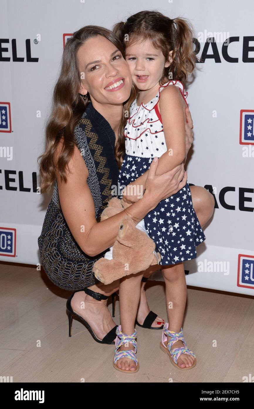 (L-R) Hilary Swank and Mackenzie Nilson, daughter of a military family ...