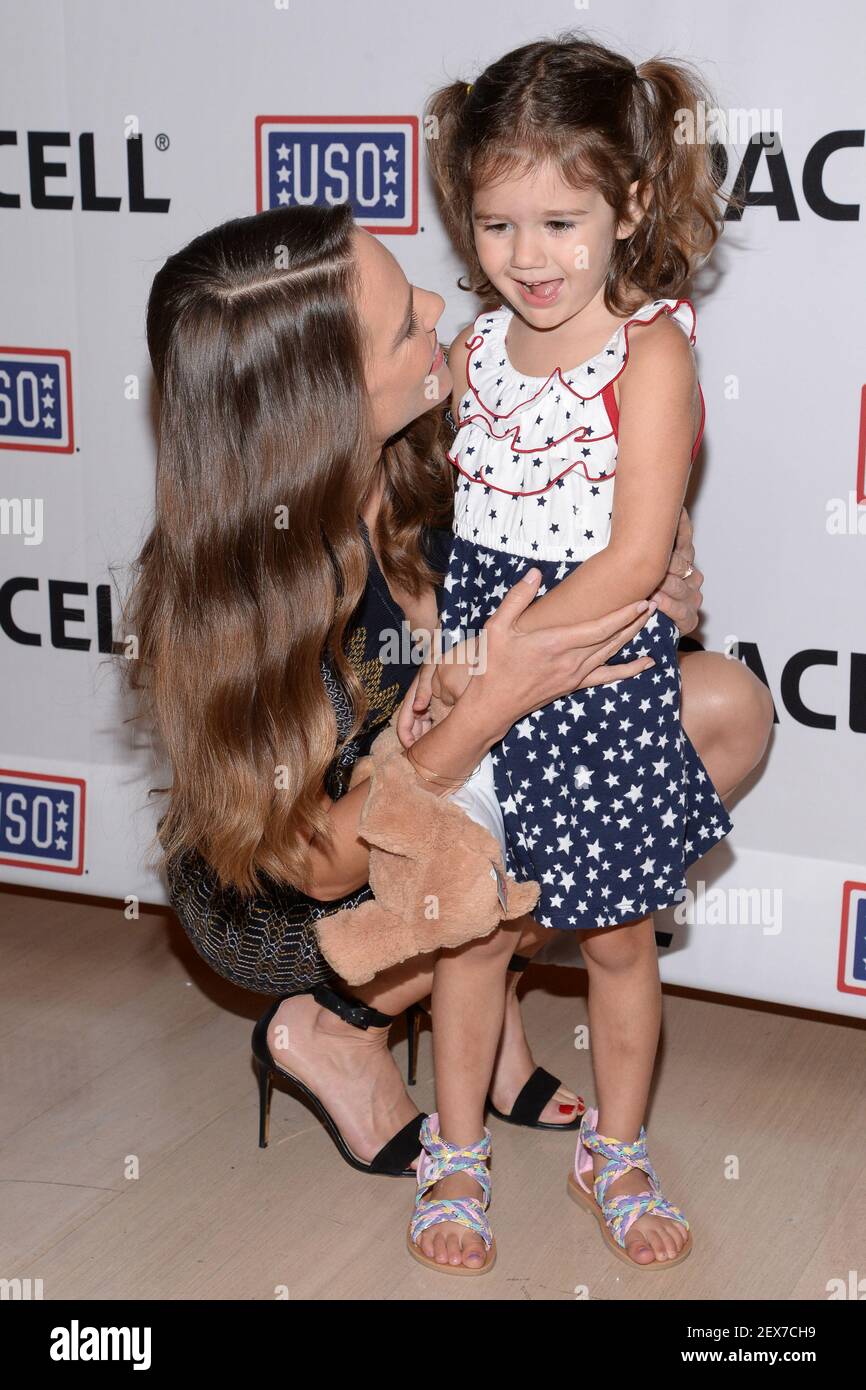 (L-R) Hilary Swank and Mackenzie Nilson, daughter of a military family ...