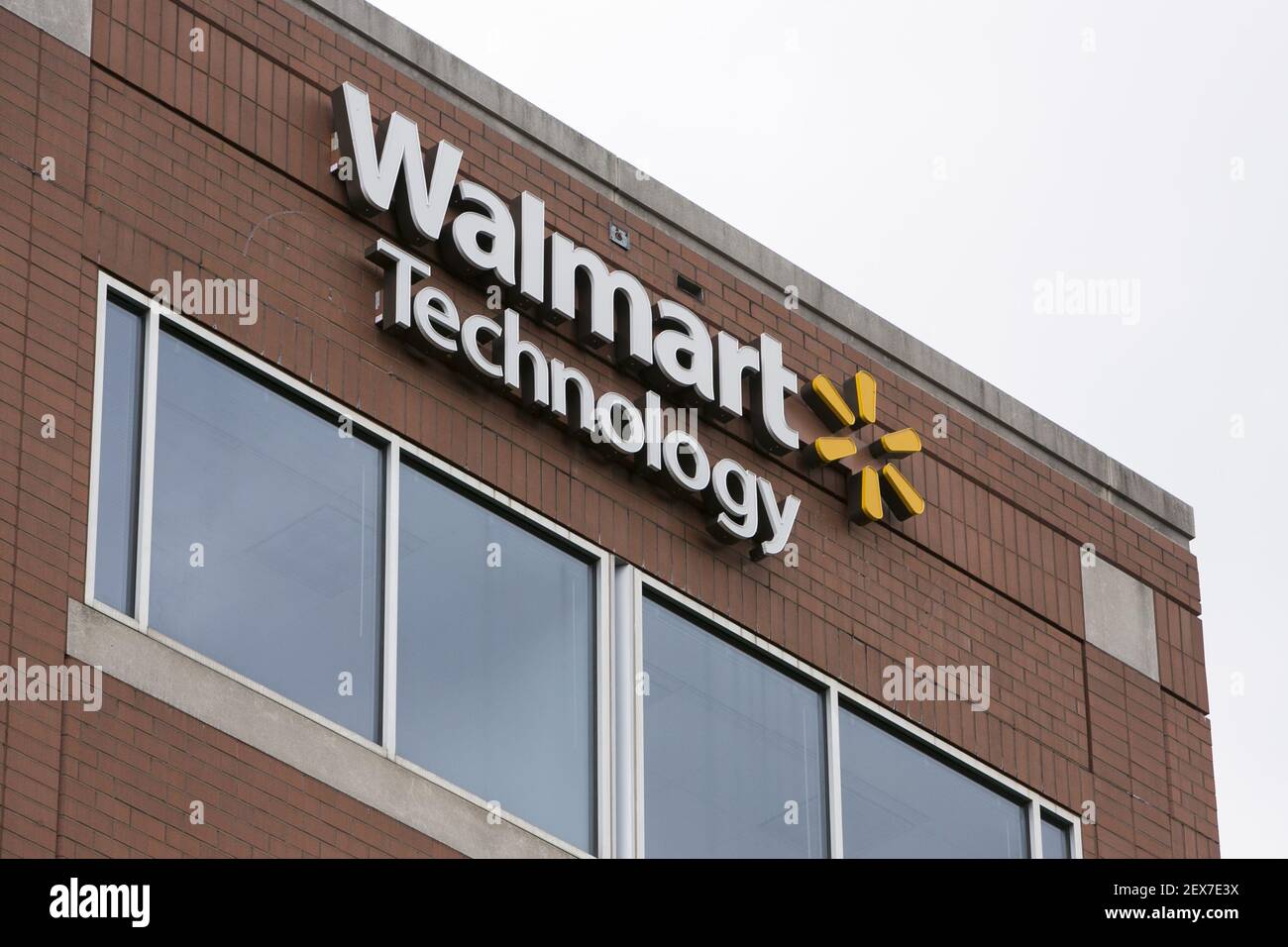 A logo sign outside of an office building occupied by Walmart ...
