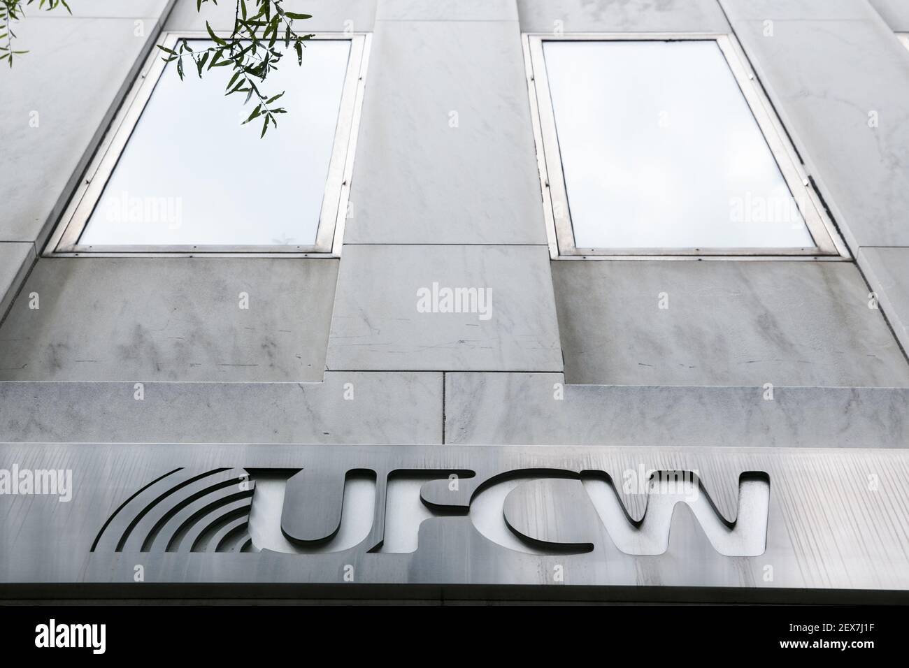 A logo sign outside of the headquarters of the United Food and ...