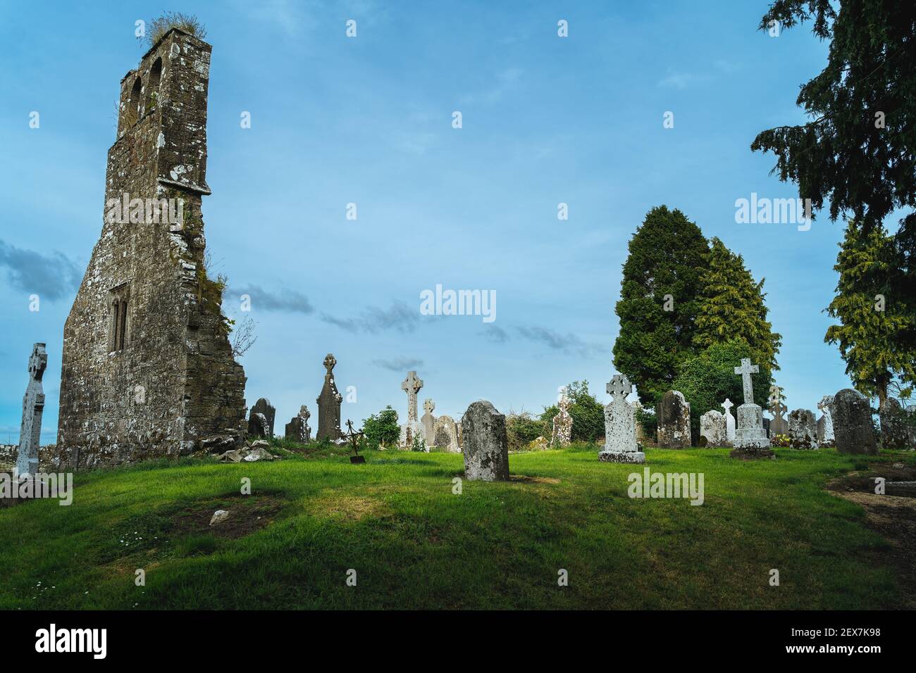 Small ancient cemetery and ruined church tower. Celtic style ...