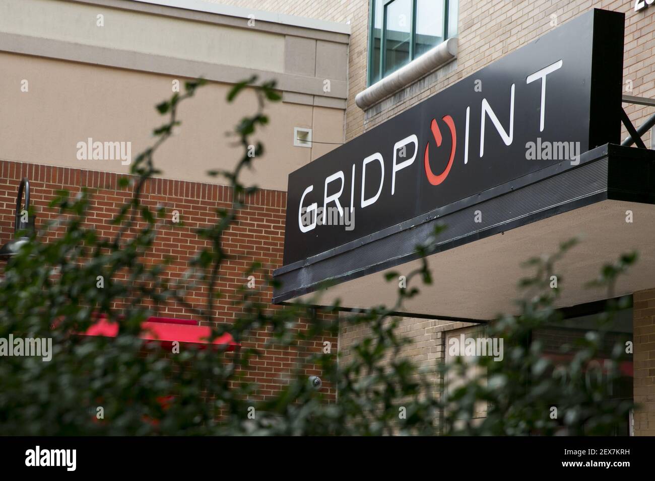 A logo sign outside of the headquarters of GridPoint in Arlington ...
