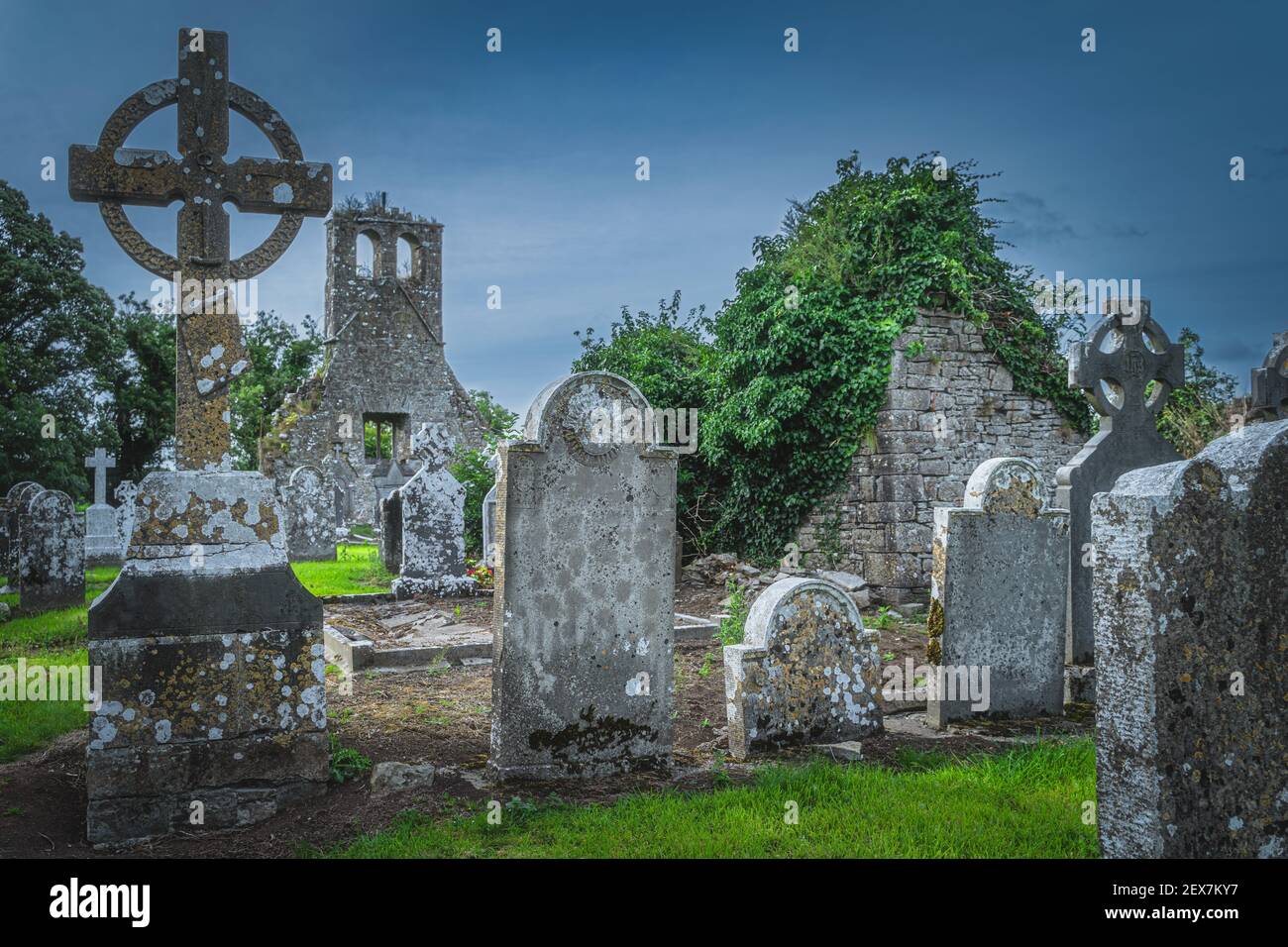 Small ancient cemetery and ruined church tower. Celtic style ...