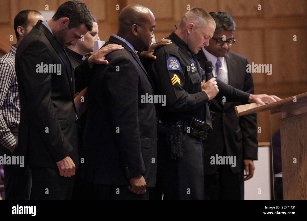 Clergy and supporters put their hands on the shoulder of Chattanooga ...