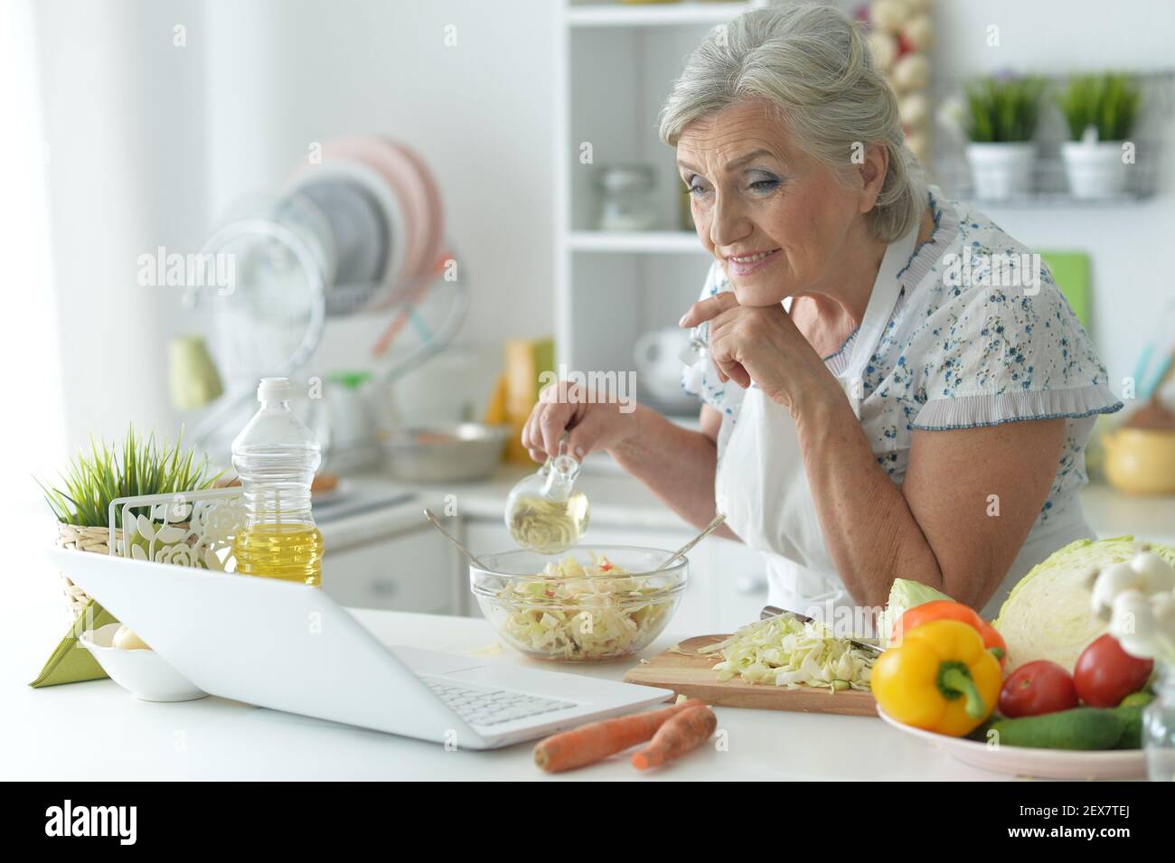 Portrait of senior woman chef portrait at kitchen Stock Photo - Alamy