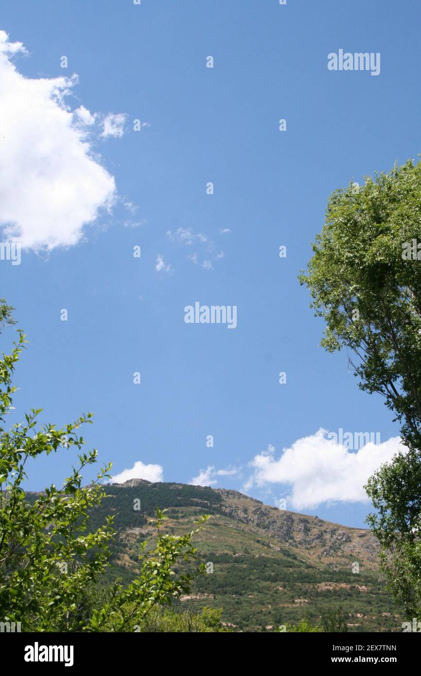 Landscape with sky , mountain, cloud and tree Stock Photo - Alamy