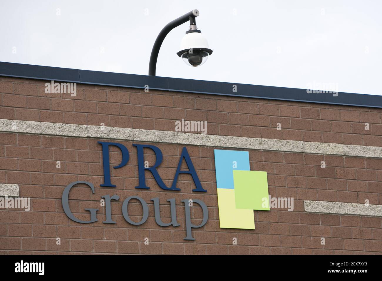 A logo sign outside of the headquarters of the PRA Group, Inc., also ...