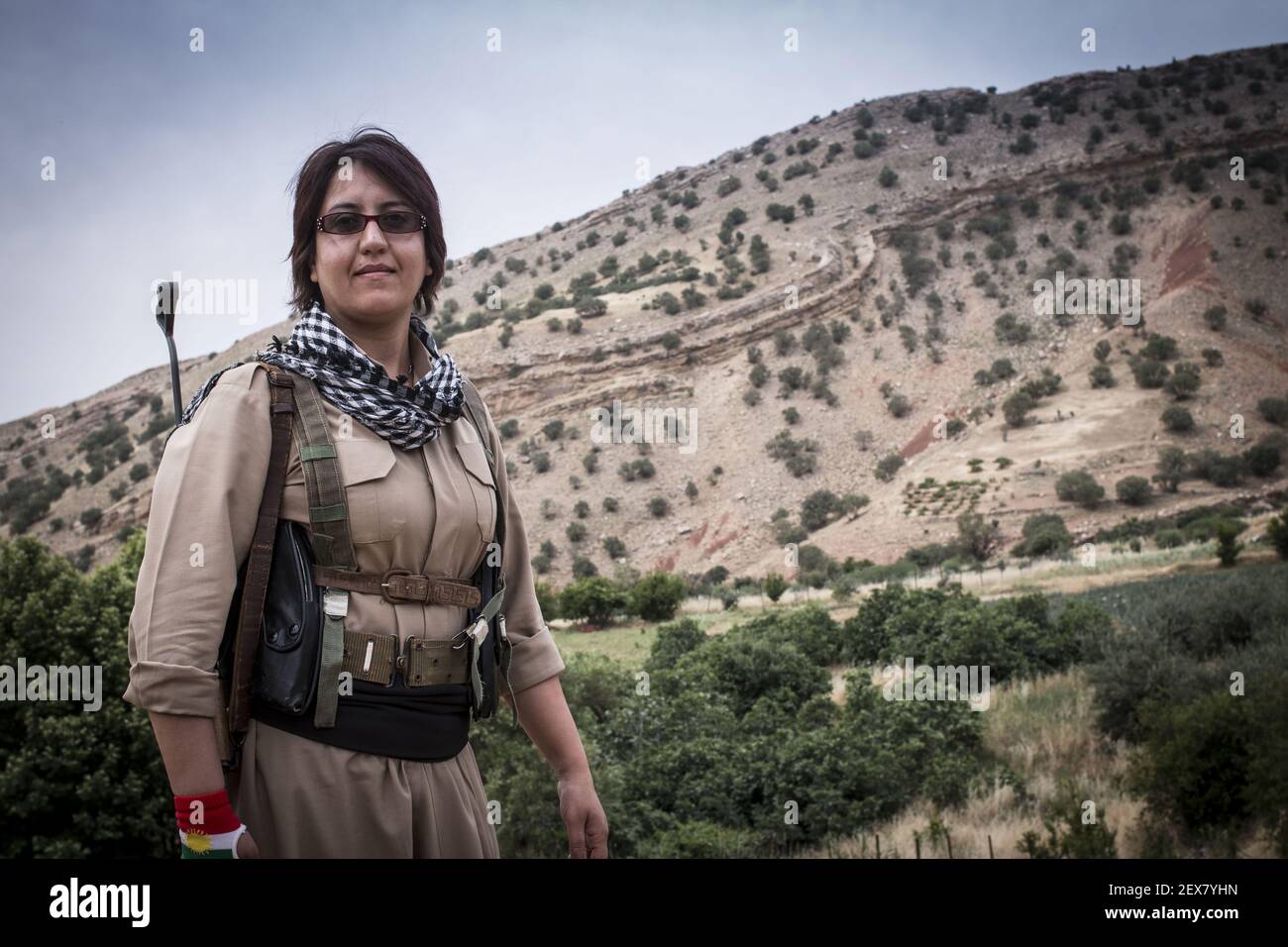 Female Kurdish Peshmerga pose on top of the mountain. Peshmergas were ...