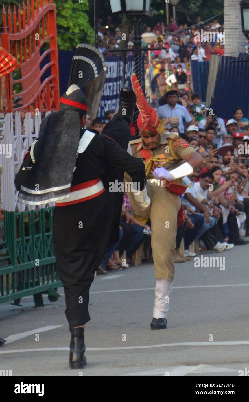 Pakistani rangers (wearing black uniforms) and Indian Border Security ...