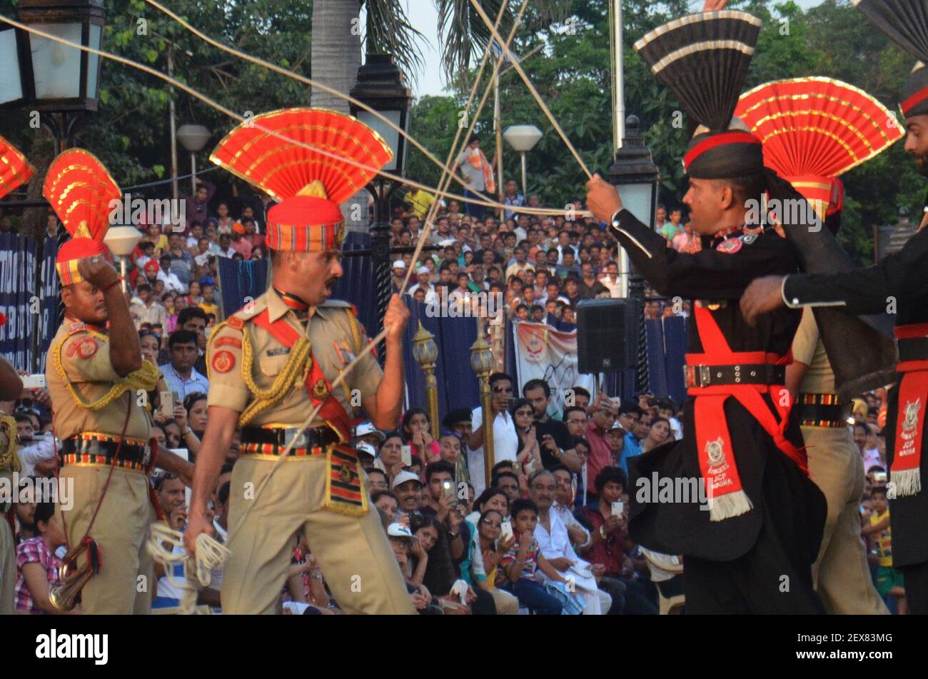 Pakistani rangers (wearing black uniforms) and Indian Border Security ...