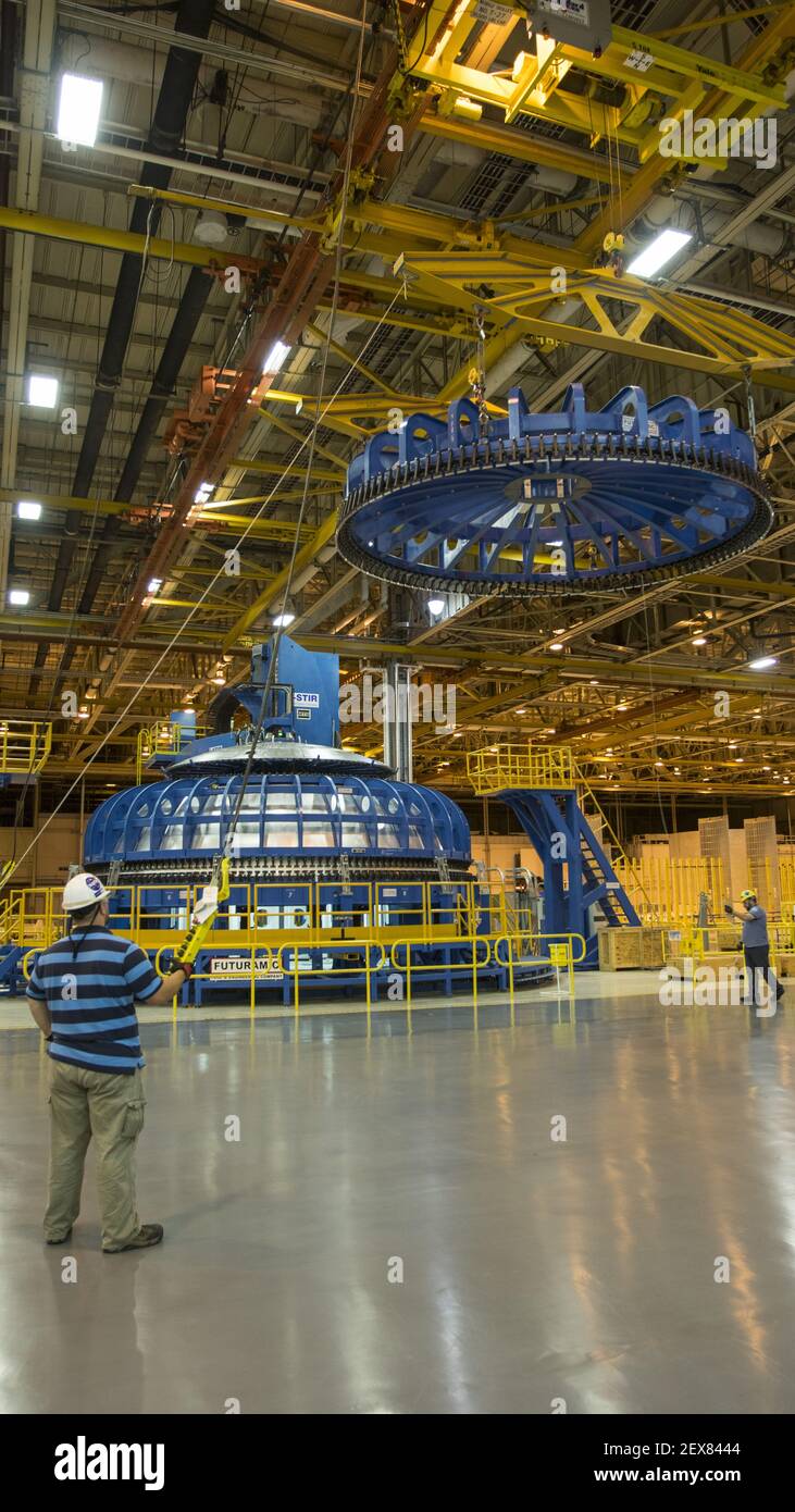 Boeing technicians use cranes and specially designed lift fixtures to ...