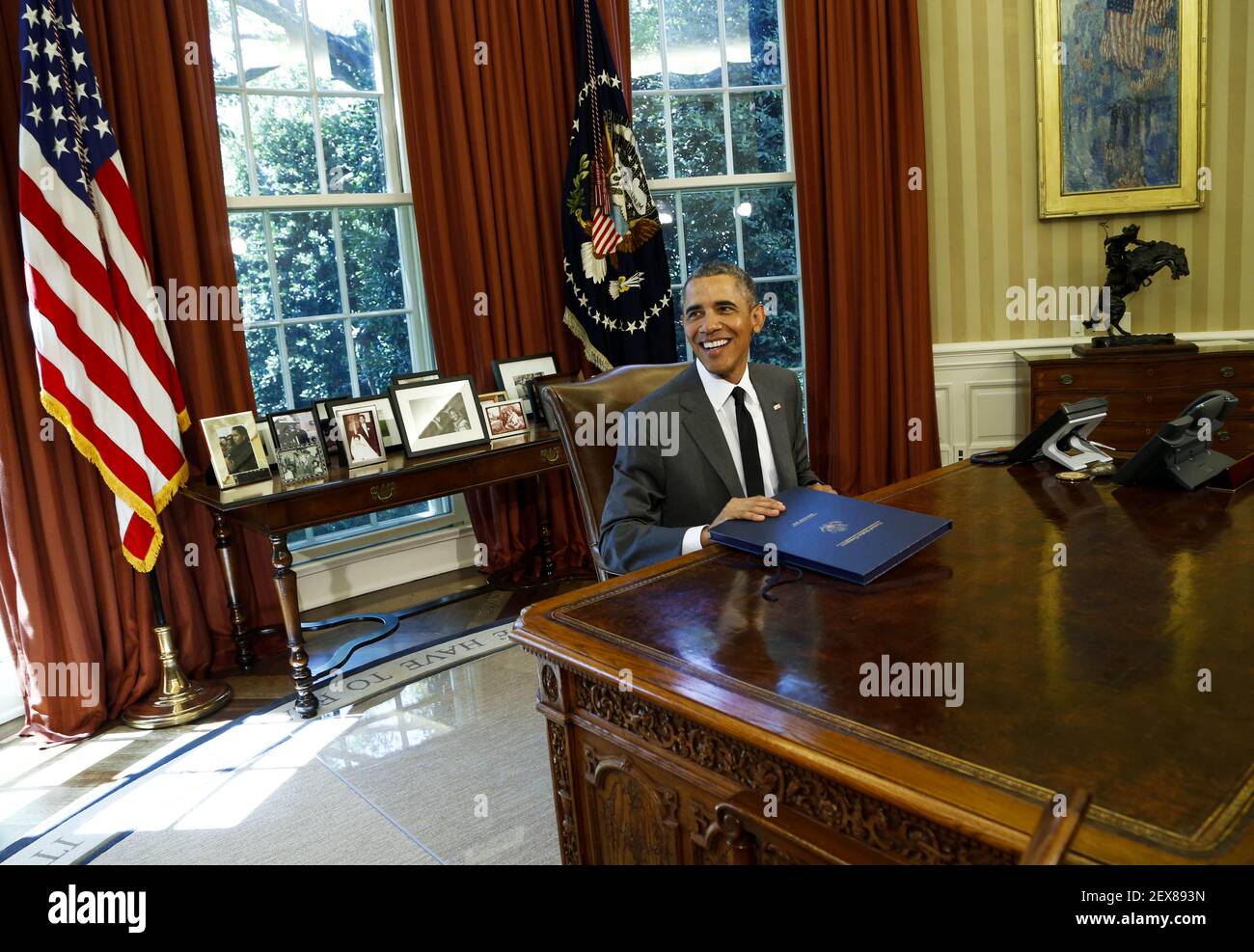 US President Barack Obama signs the Surface Transportation and Veterans ...