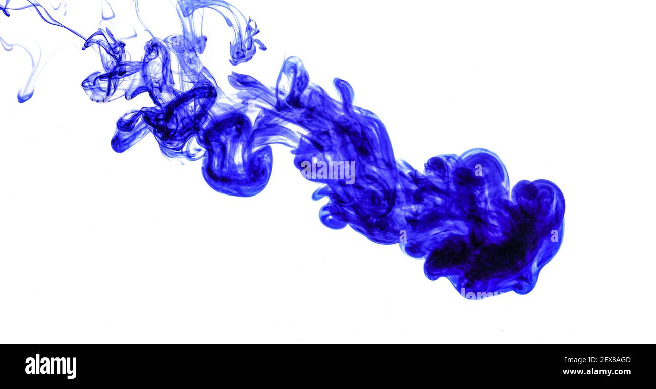 Blue ink injected into water from syringe, colour mixing with water ...