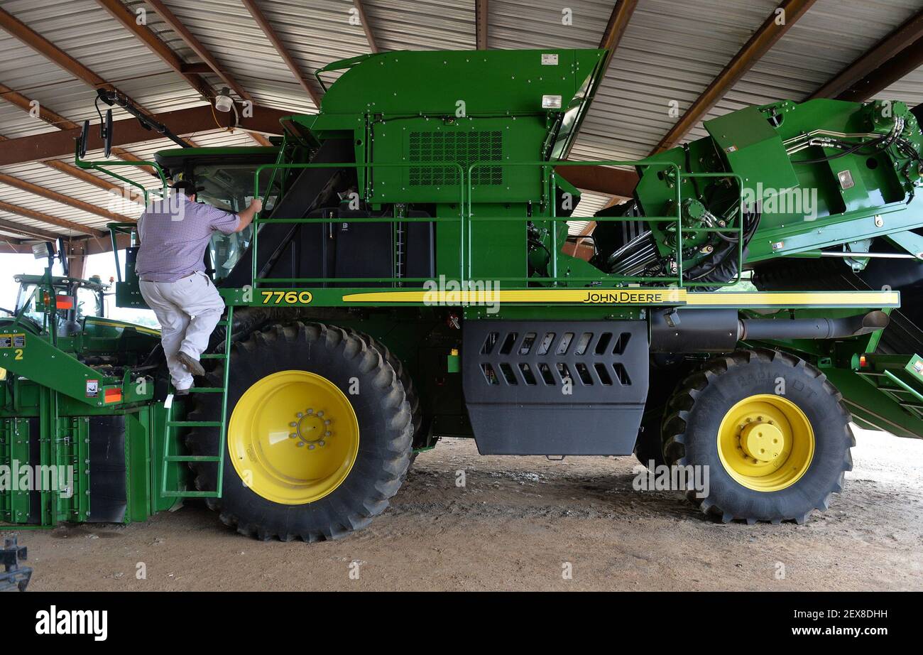 Matt Coley climbs aboard his John Deere cotton picker. The machine ...