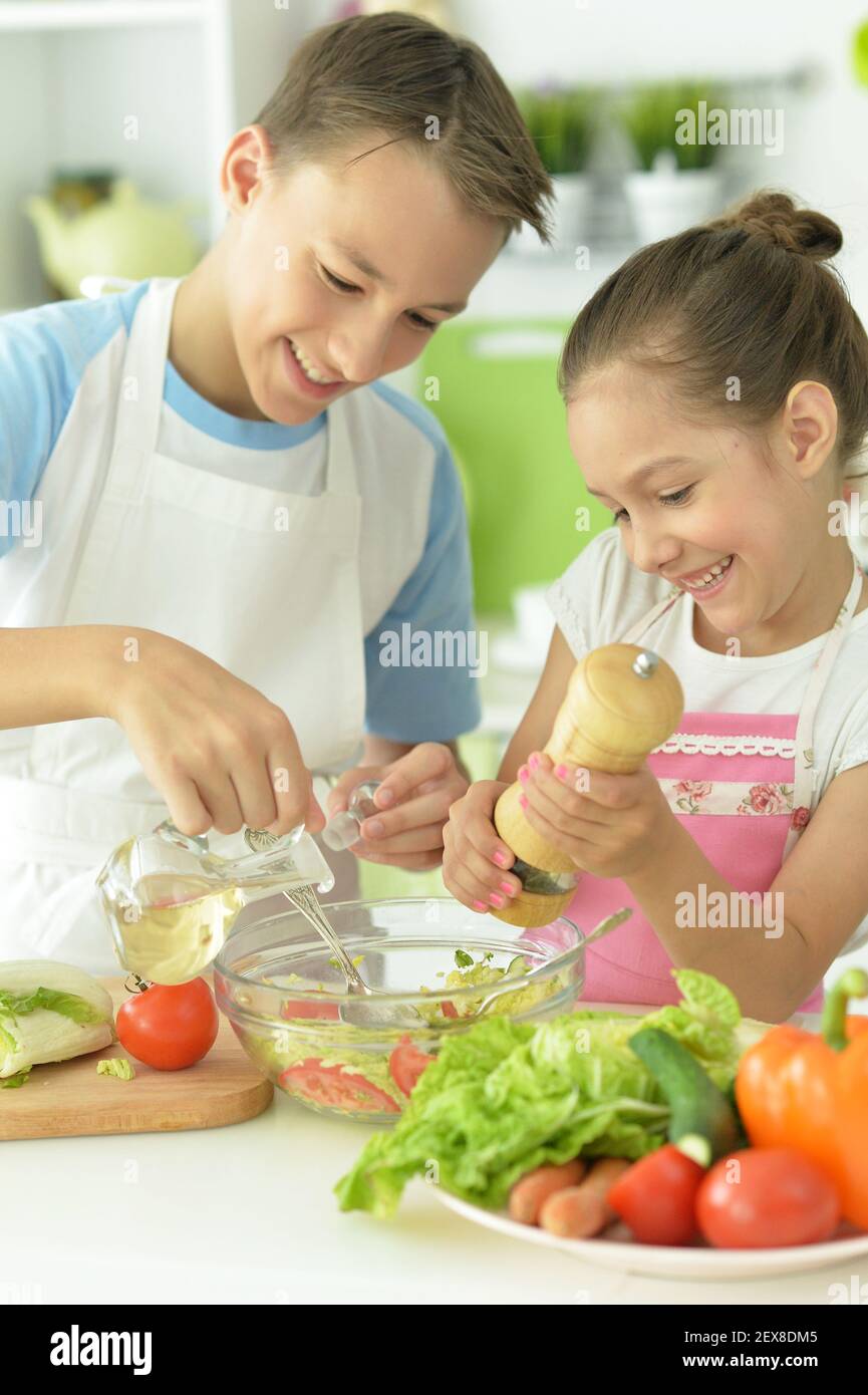 Cute brother and sister cooking together in kitchen Stock Photo - Alamy