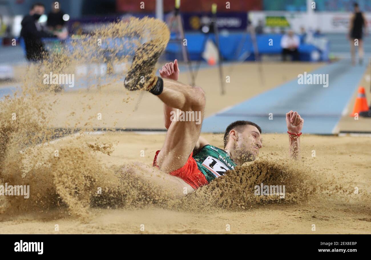 ISTANBUL, TURKEY - FEBRUARY 20, 2021: Undefined athlete long jumping ...