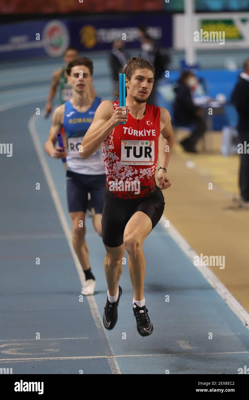 ISTANBUL, TURKEY - FEBRUARY 20, 2021: Athletes running 4x400 metres ...