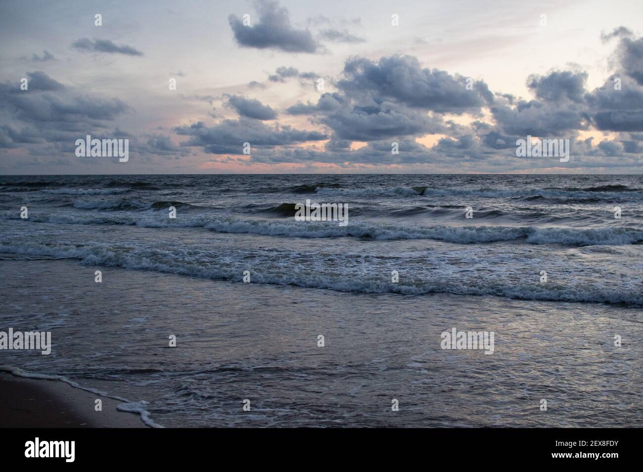 Evening seascape with clouds and waves. Dramatic Seascape Stock Photo ...