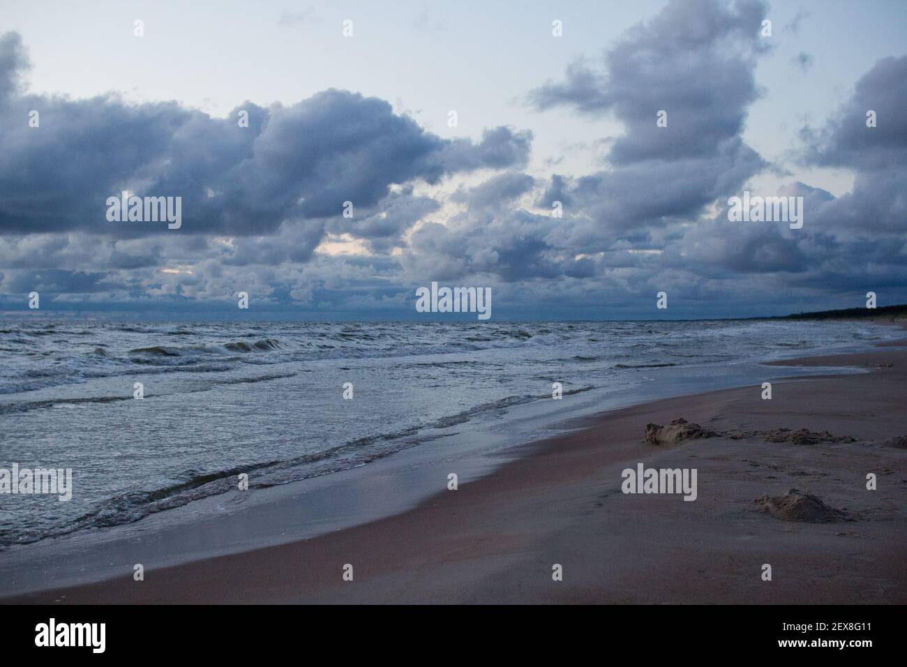 Evening seascape with clouds and waves. Dramatic Seascape Stock Photo ...
