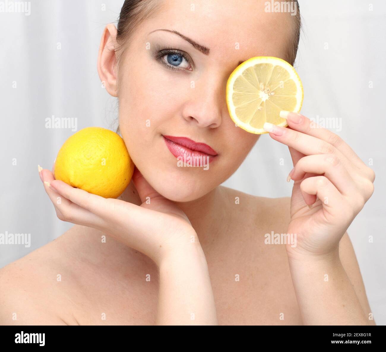 Beautiful woman with lemon Stock Photo - Alamy