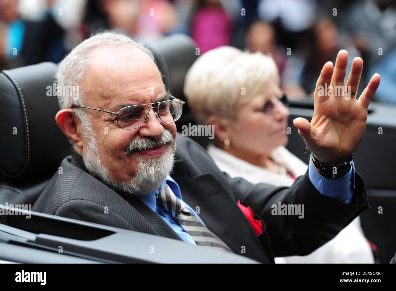 Nuclear physicist Stanton T. Friedman waves to the crowd at the 16th ...