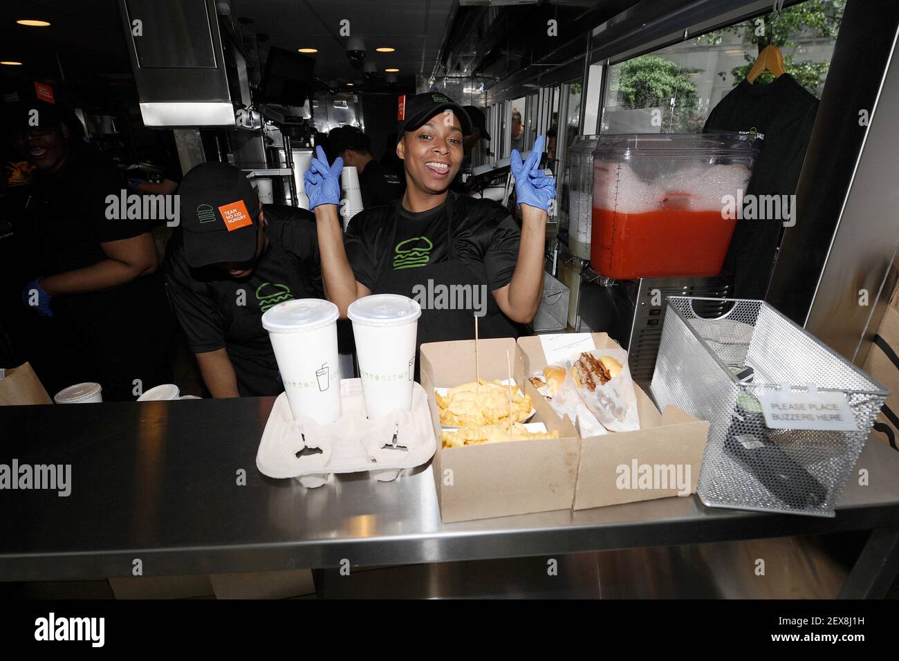 Shake Shack server Vanessa Sanders greets customer with enthusiasm as ...