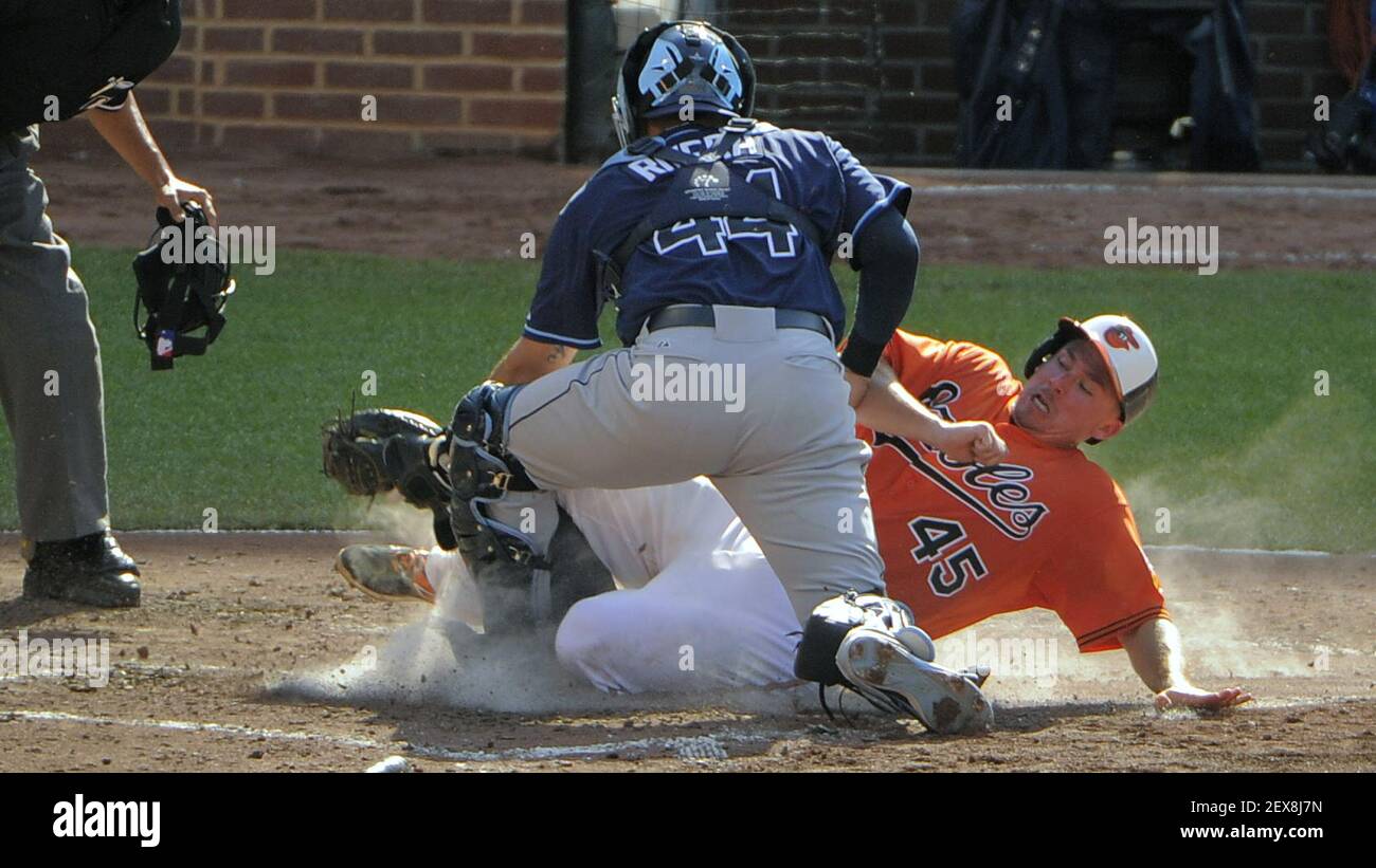The Baltimore Orioles' Steve Clevenger (45) slides into the tag of ...