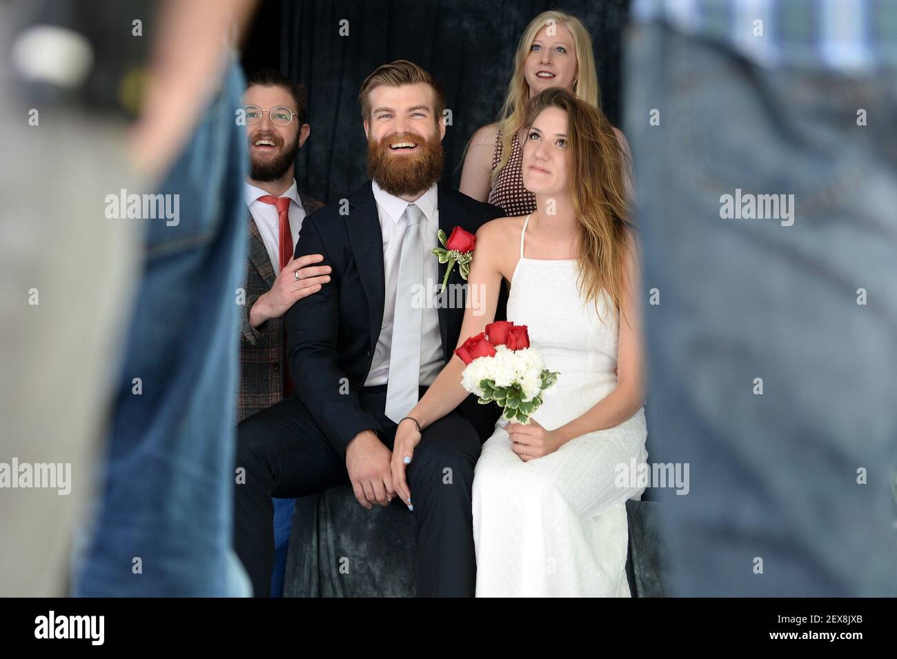 Photographer Joe McNally photographs Carl Waters (beard) and Jenna ...
