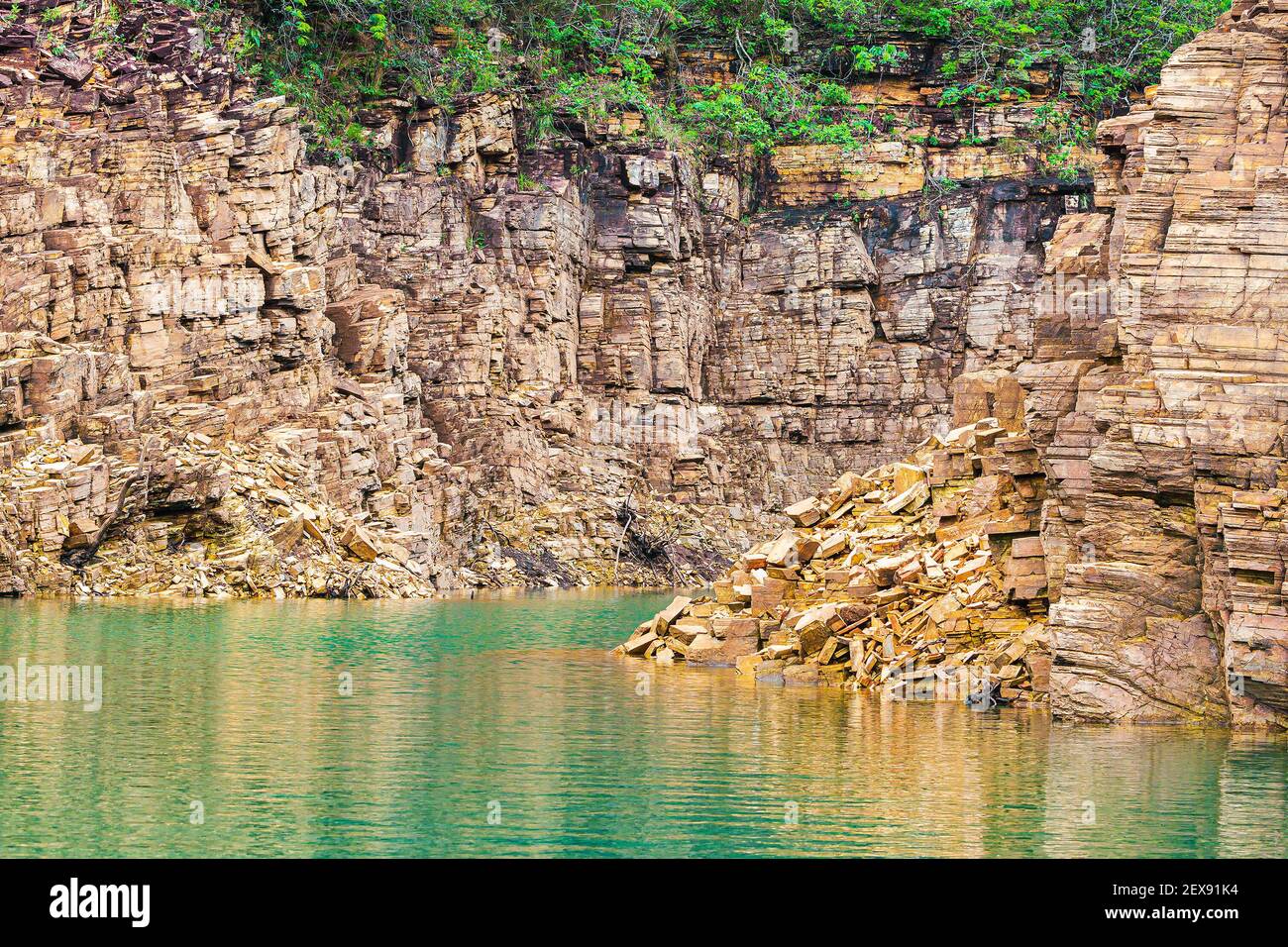 Beautiful landscape with sedimentary rock walls with golden tones and ...