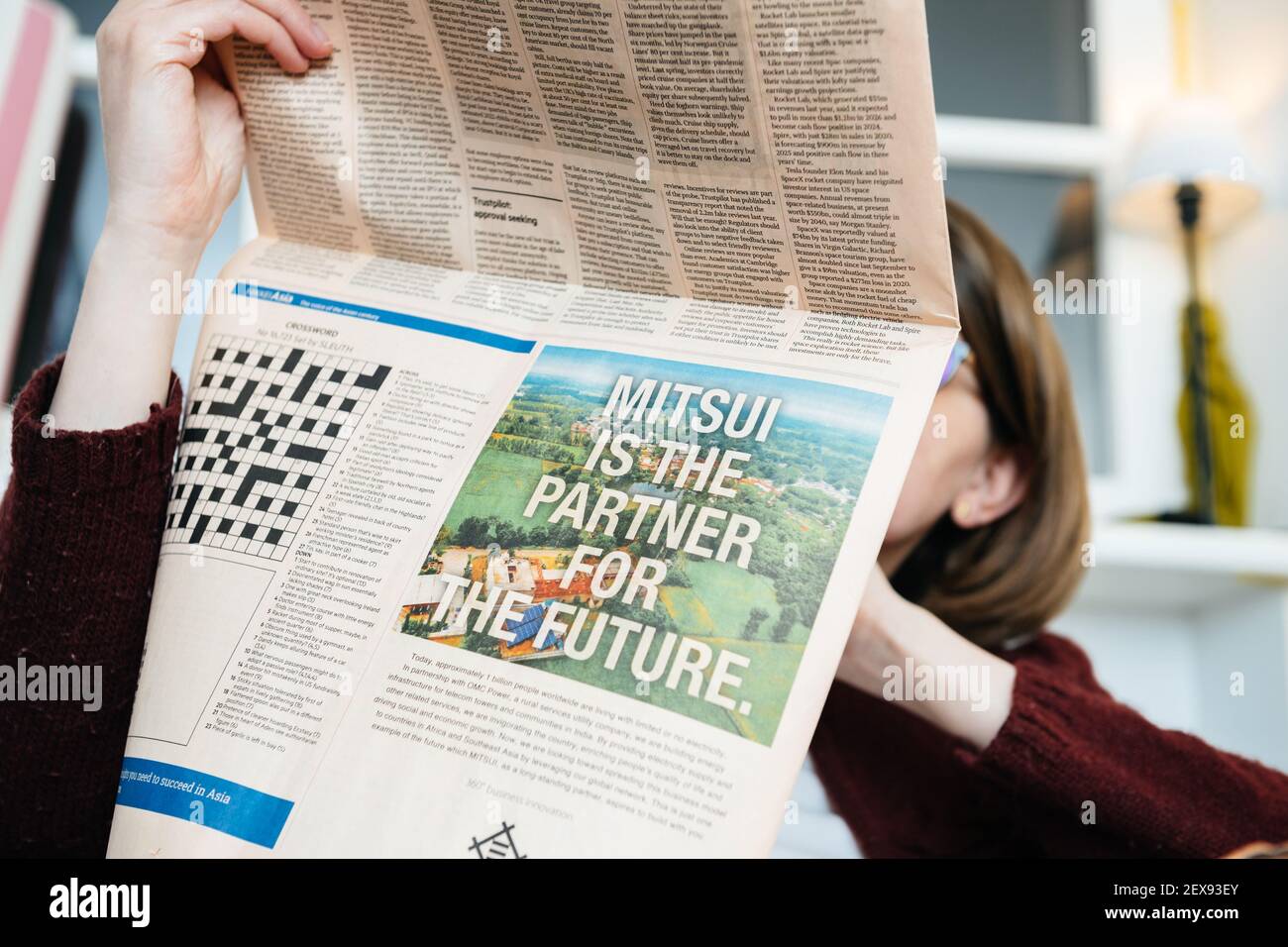 Paris, France - Mar 2, 2021: Business woman reading Financial Times ...