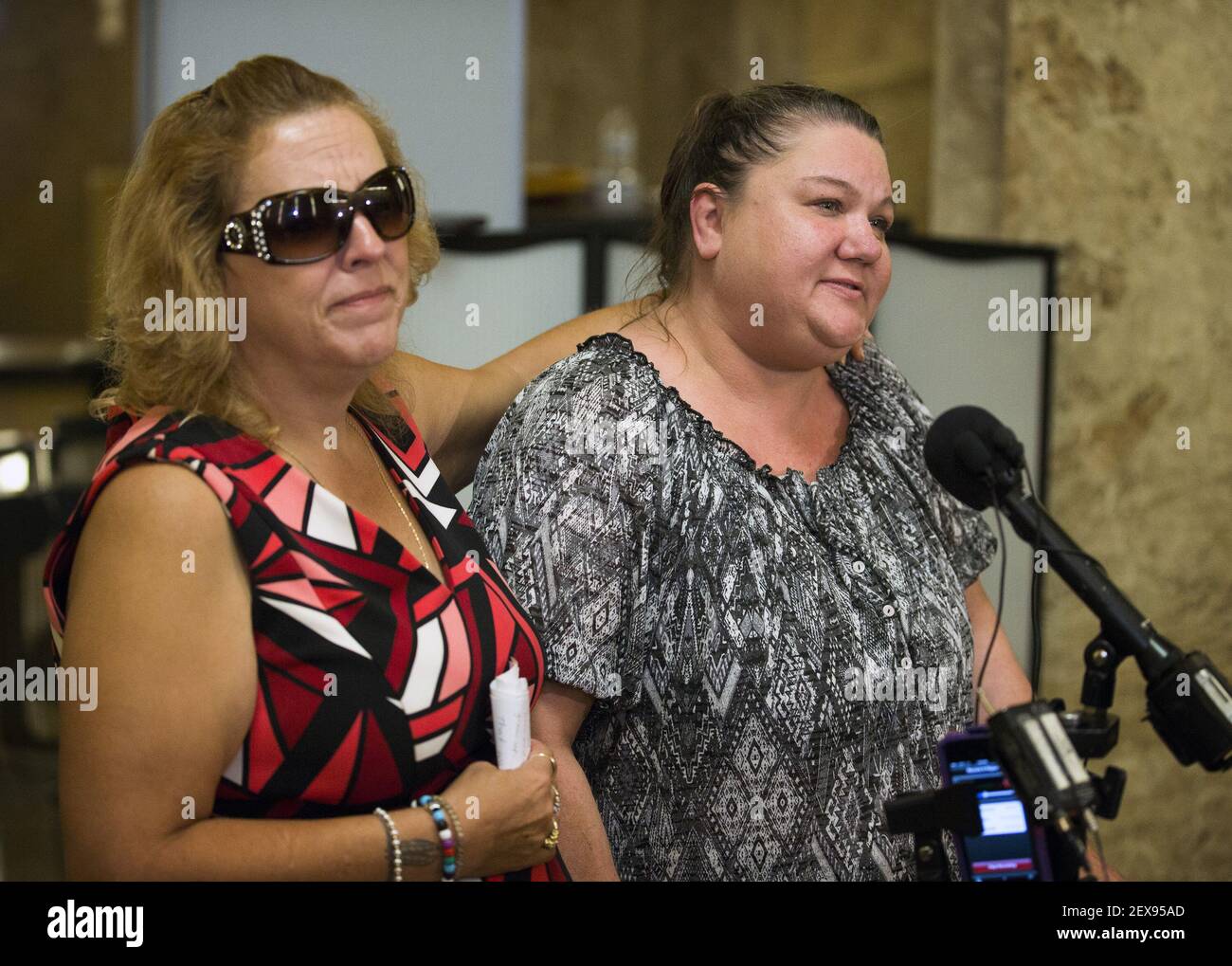 Jennifer Cleven and Kim Higgins speak to the media on Aug. 18, 2015 in ...