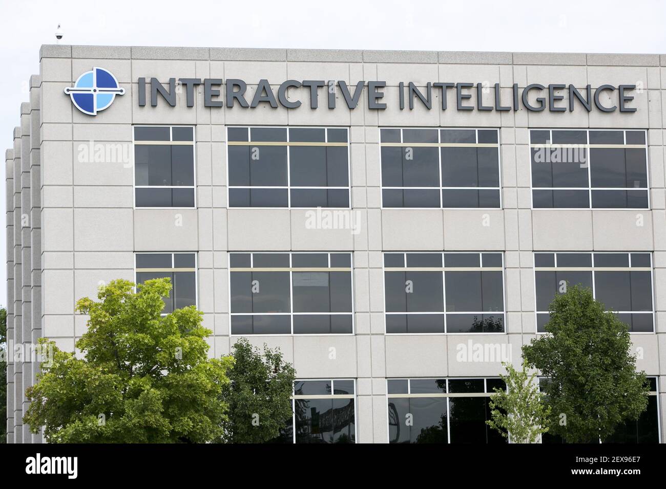 A logo sign outside of the headquarters of Interactive Intelligence ...