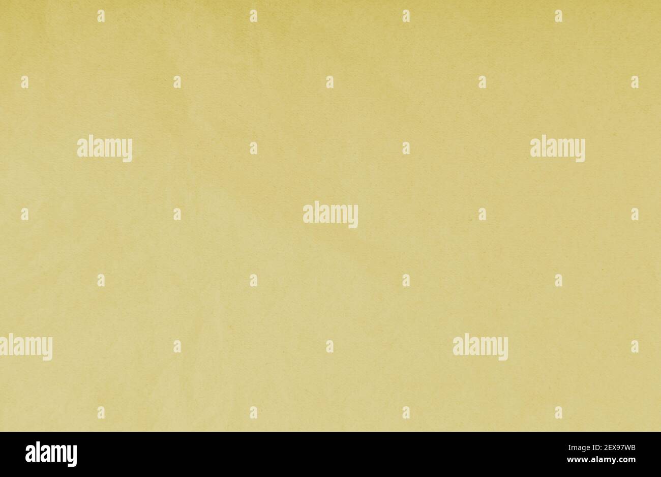 A rough-textured dark yellow grainy paper used as wallpaper or ...
