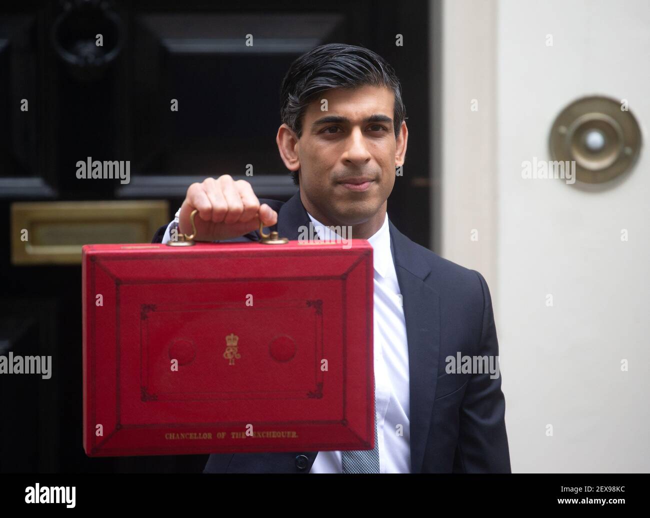 Chancellor of the Exchequer, Rishi Sunak, holds up the famous red ...