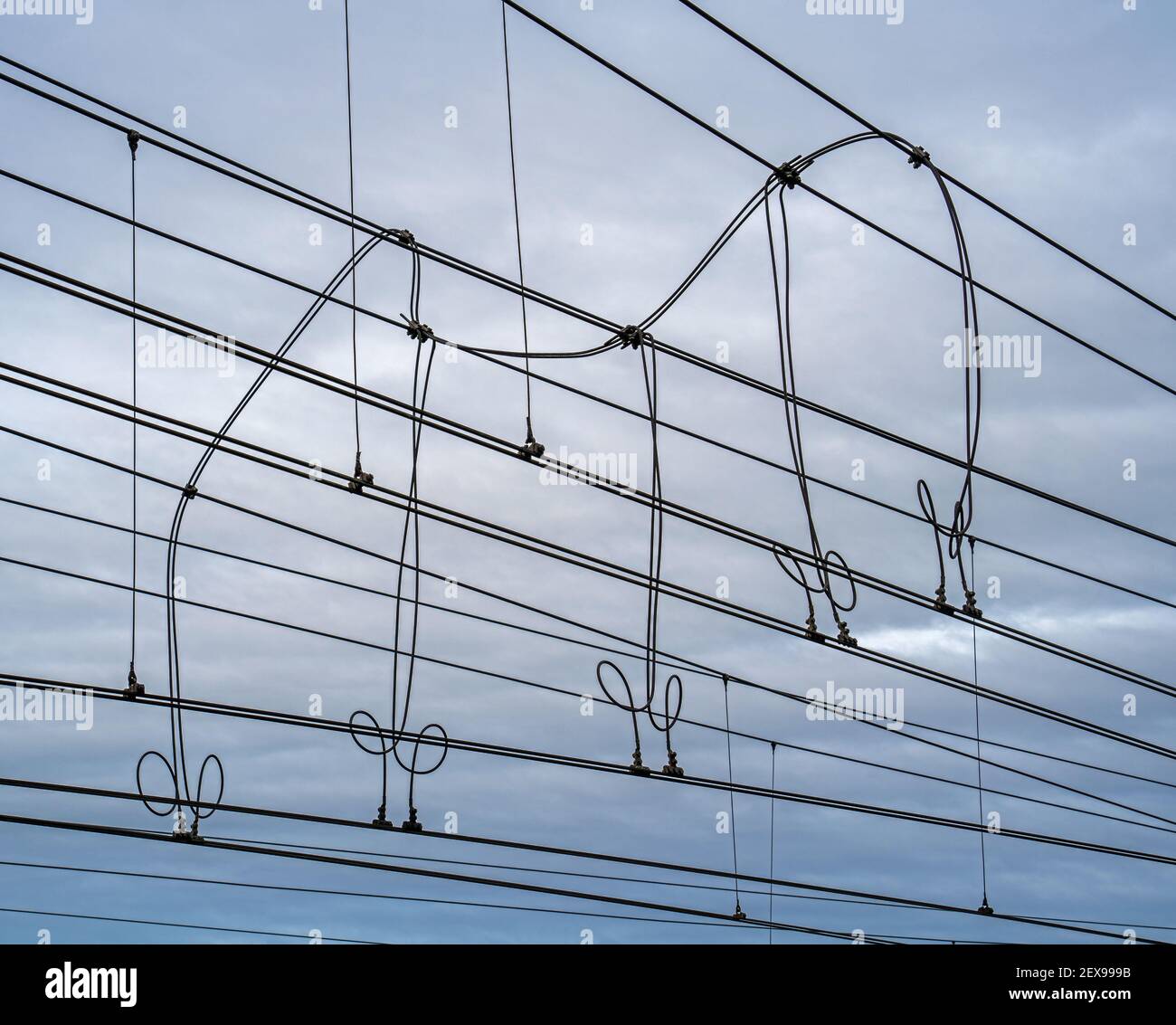 Detail of a railroad overhead line Stock Photo - Alamy