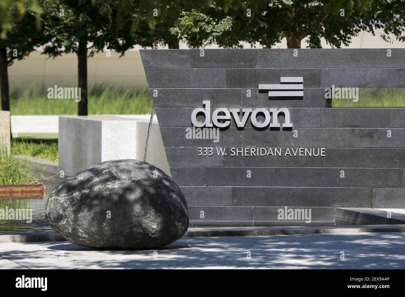 A logo sign outside of the Devon Energy Center, headquarters of the ...