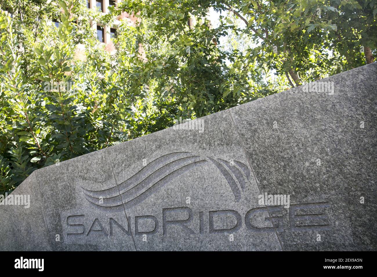 A logo sign outside of the headquarters of SandRidge Energy, in ...