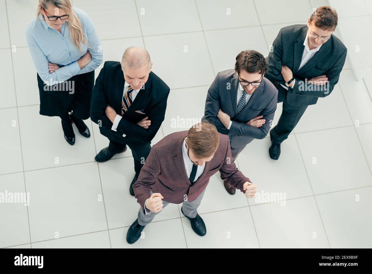 top view. leader and a group of employees standing together Stock Photo ...