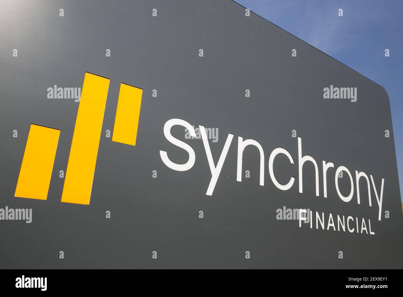 A logo sign outside of a facility occupied by Synchrony Financial in ...