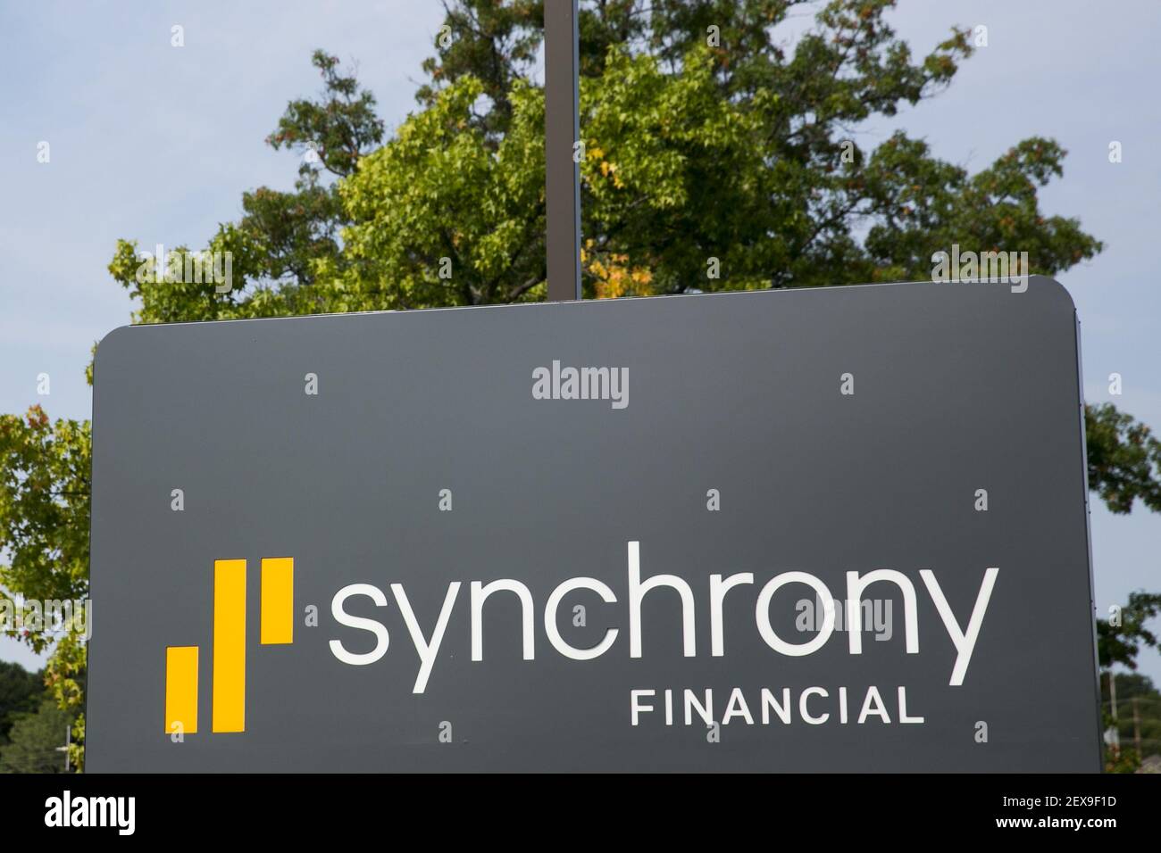 A logo sign outside of a facility occupied by Synchrony Financial in ...